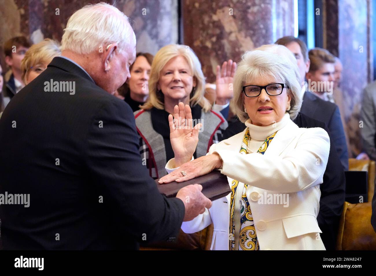 Mississippi State Sen. Robin Robinson, R-Laurel, places her left hand ...
