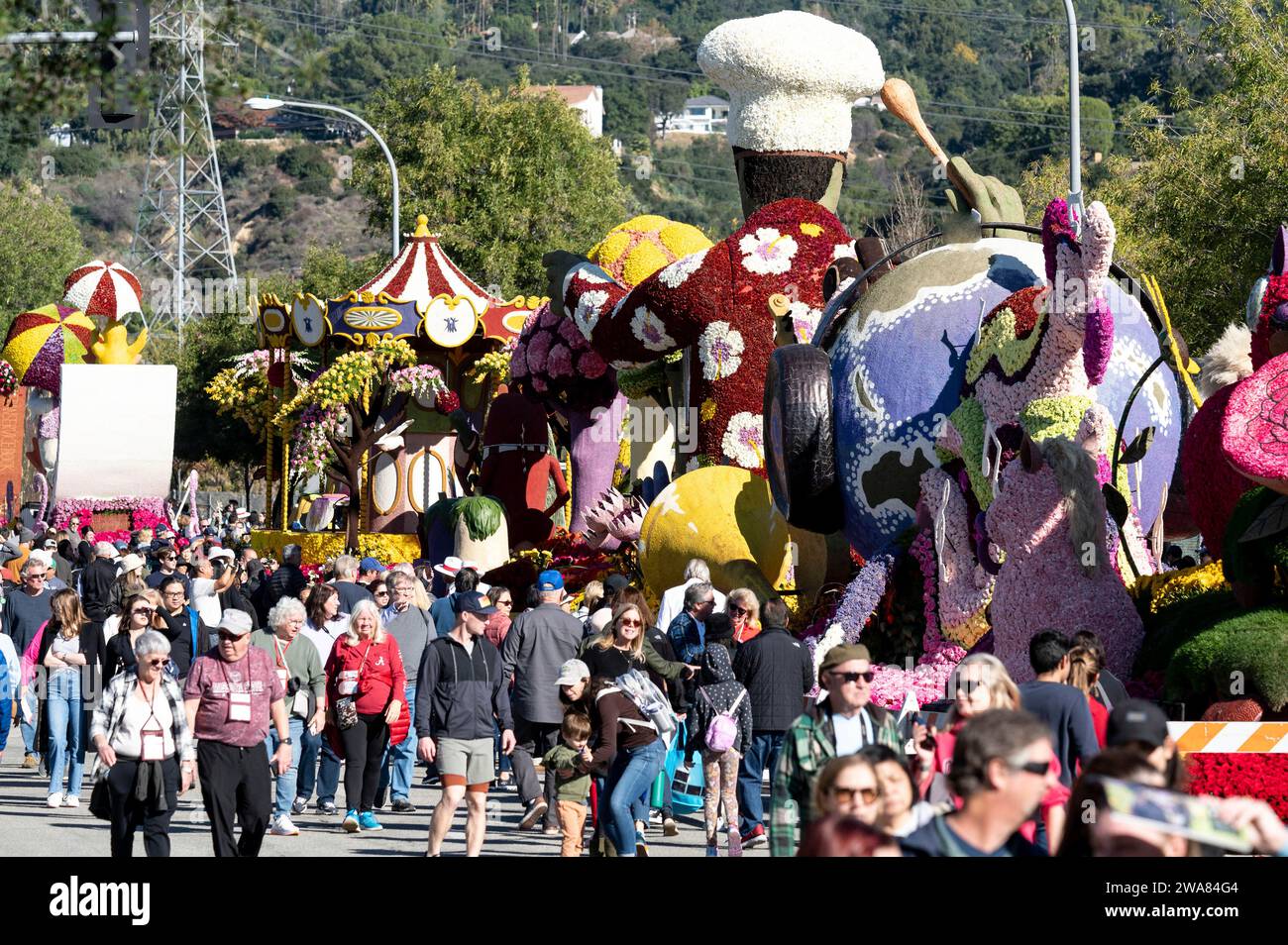 Crowds gather around Rose Parade floats during the Floatfest, Tuesday ...