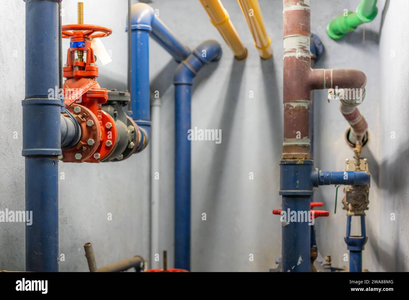 The interior of a mechanical room and a domestic potable water system ...