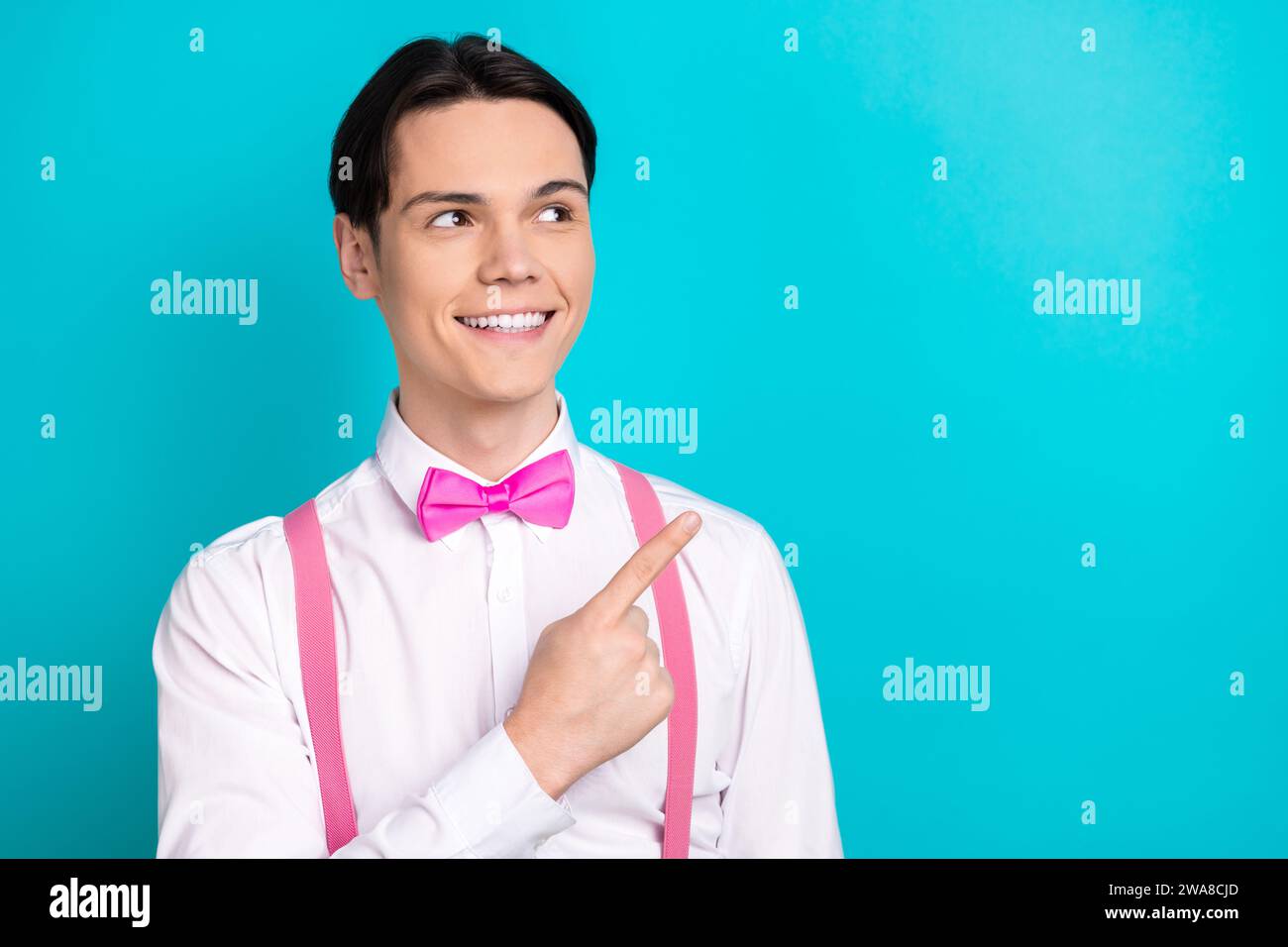 Photo portrait of handsome young guy point look empty space wear trendy ...