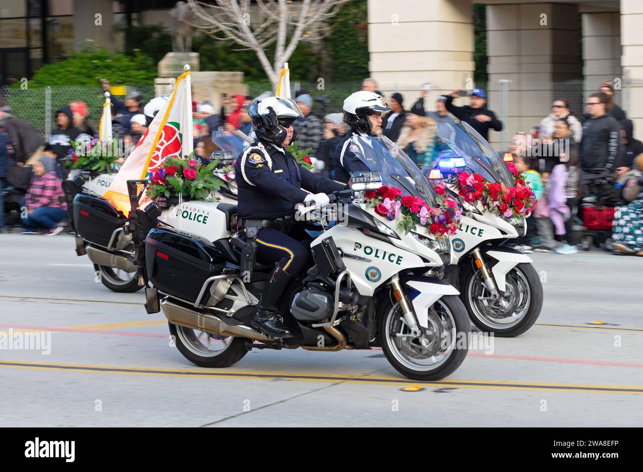 Motorcycle Pasadena Police Officers shown driving on Colorado Boulevard ...