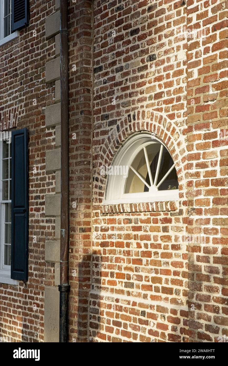 Half-round window in brick wall of Federal style James Missroon house ...