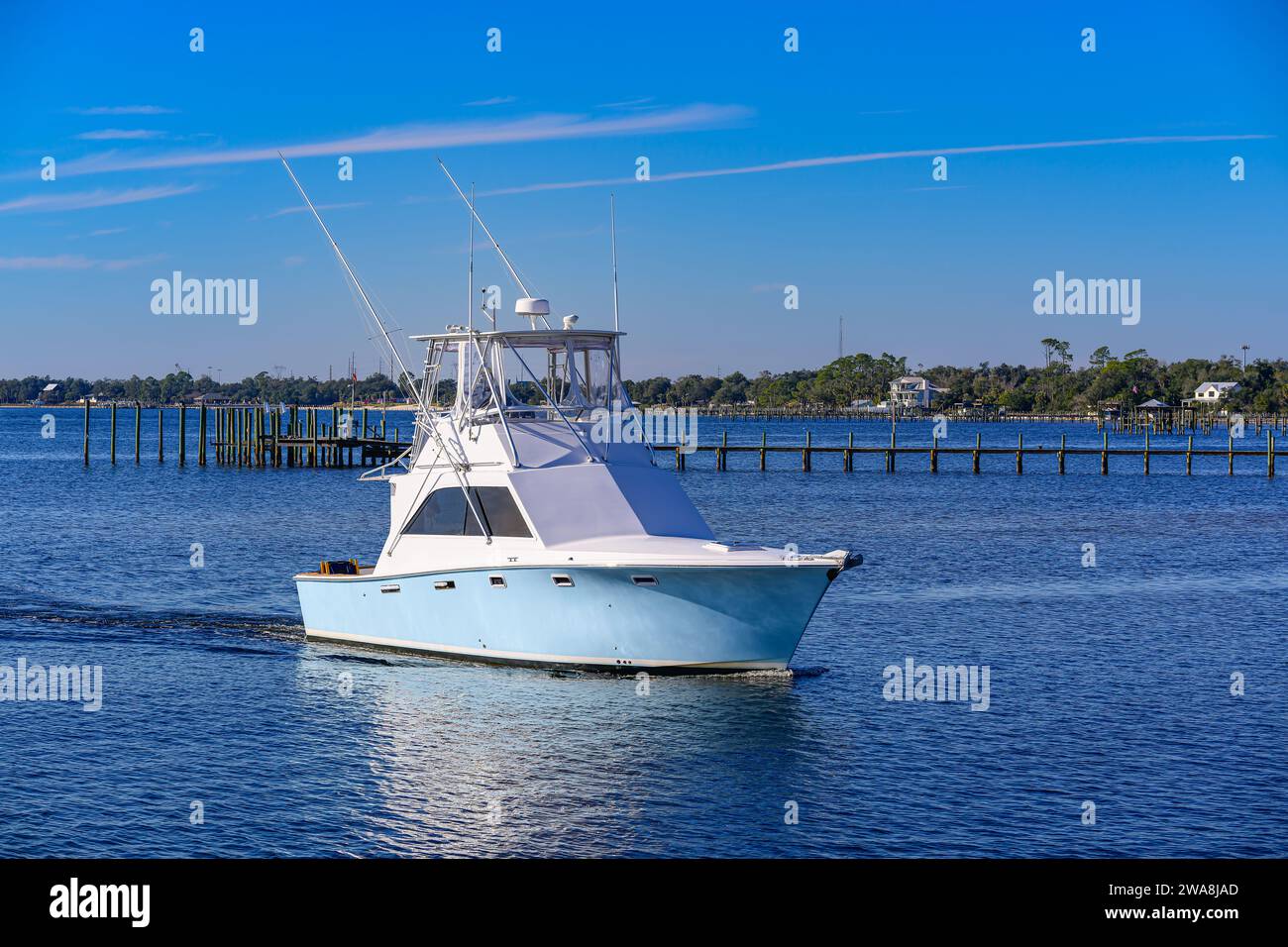 A fishing boat gracefully returns to port, carrying the echoes of a day ...