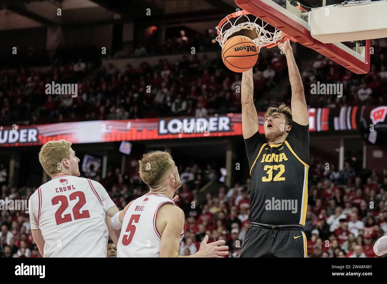 Iowa's Owen Freeman (32) dunks in front of Wisconsin's Steven Crowl (22 ...