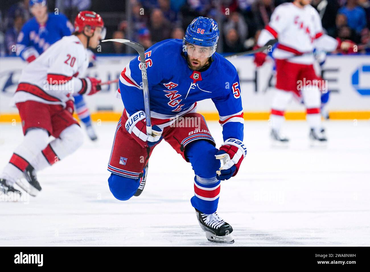 New York Rangers defenseman Erik Gustafsson (56) skates to the puck ...