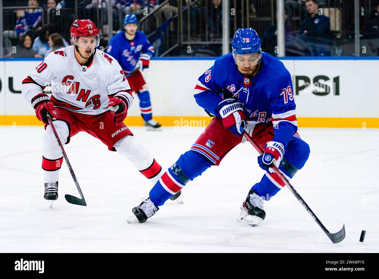 New York Rangers defenseman K'Andre Miller (79) is pursued by Carolina ...
