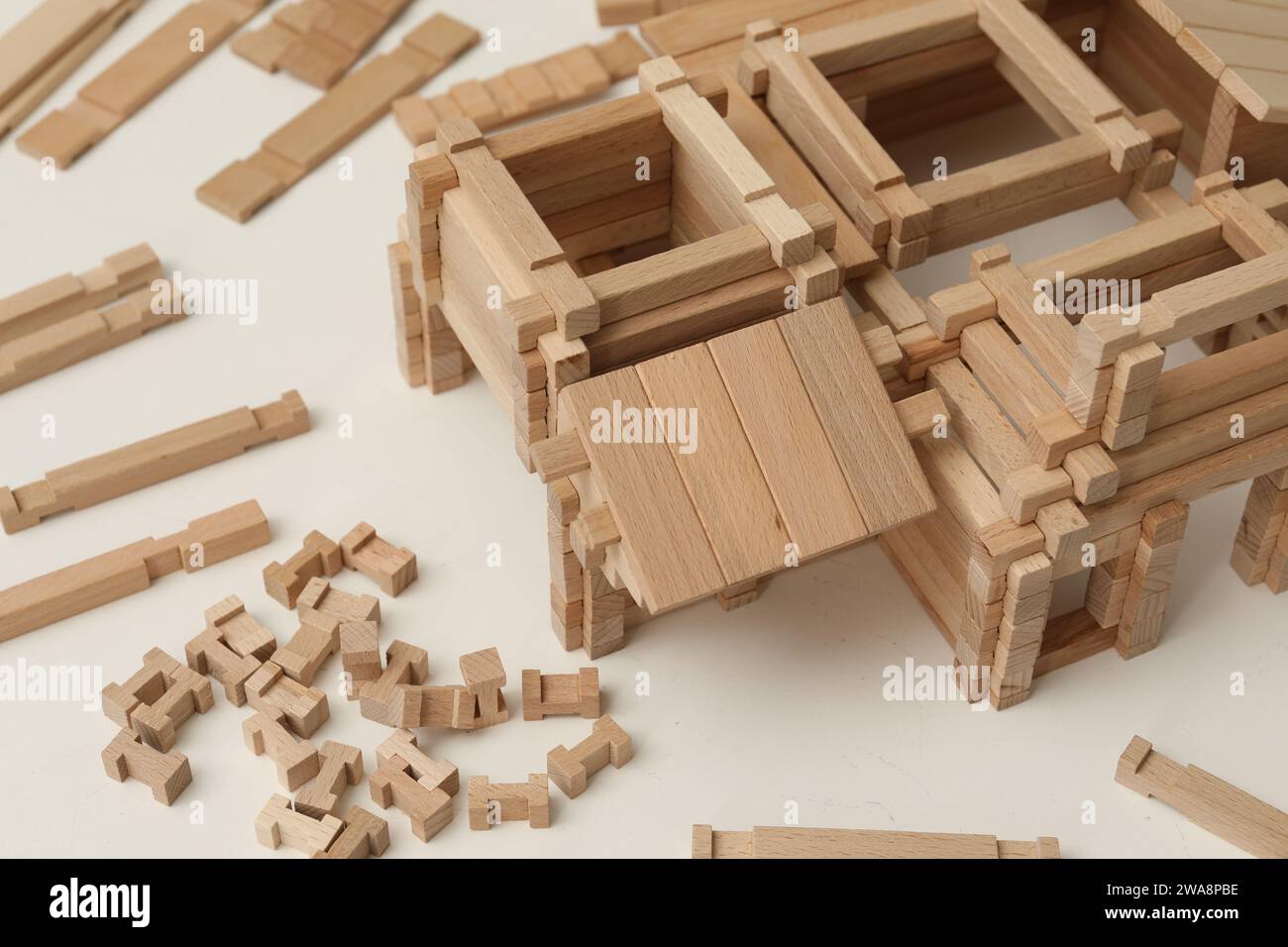 Wooden construction set on white table, closeup. Children's toy Stock ...