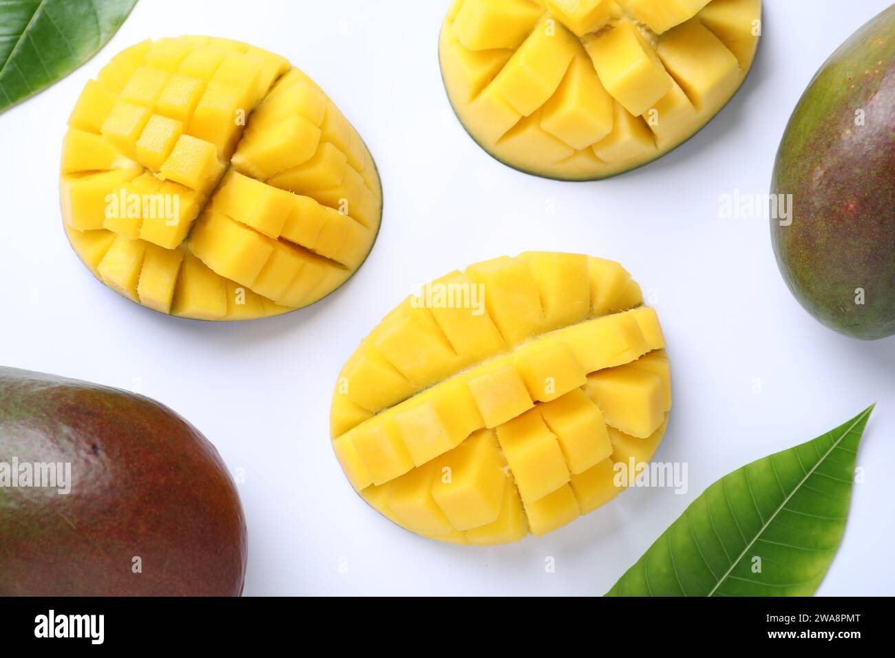 Ripe mangoes on white background, flat lay Stock Photo - Alamy