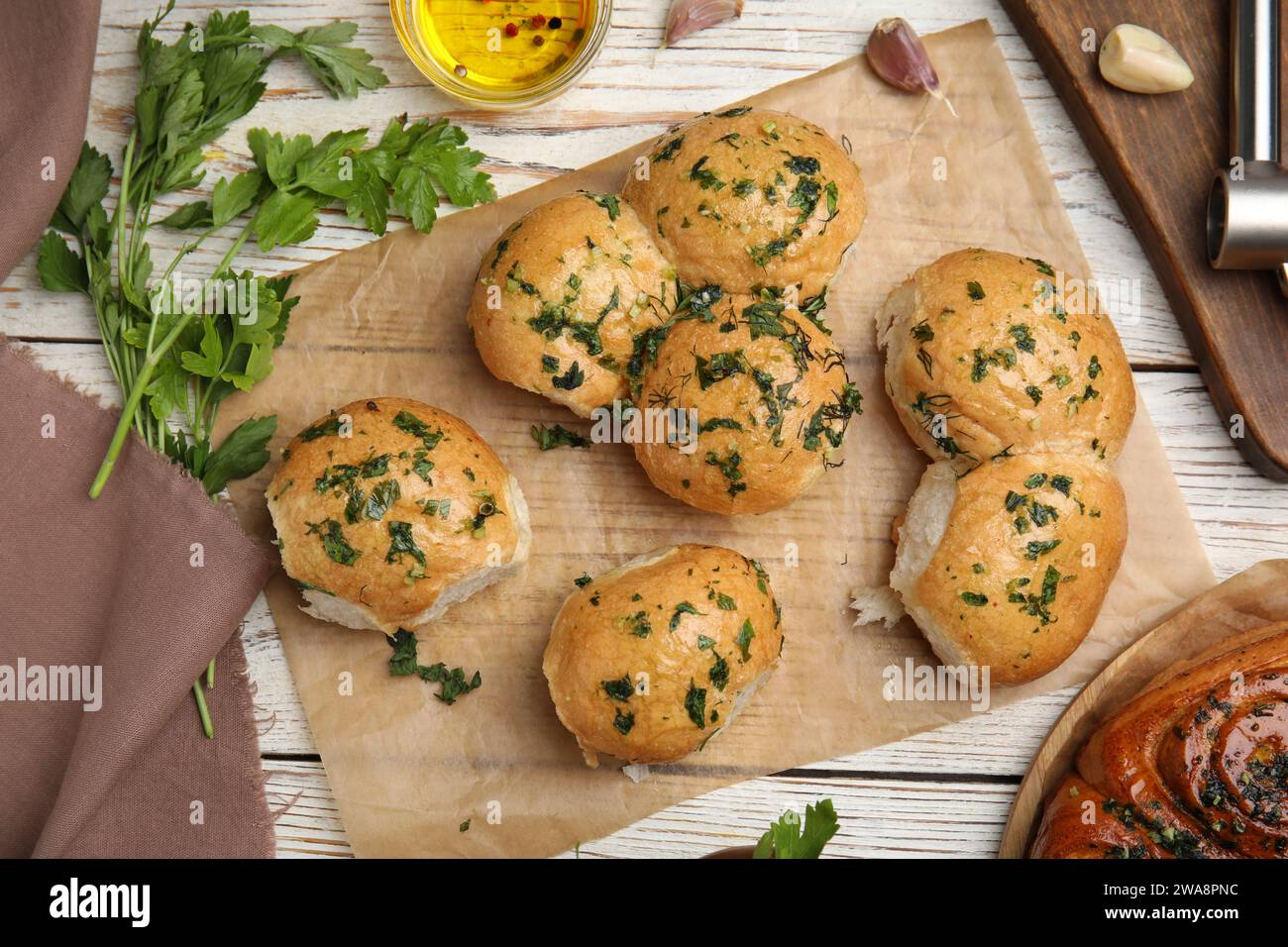 Traditional Ukrainian bread (Pampushky) with garlic on white wooden ...