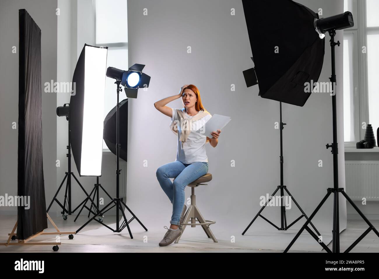 Casting call. Emotional woman with script performing on grey background ...