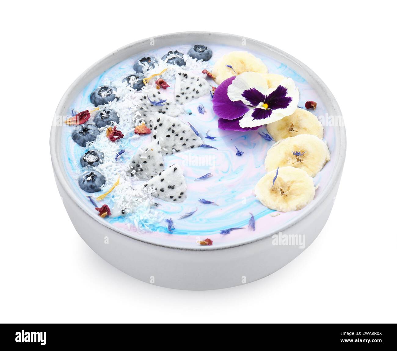 Delicious smoothie bowl with fresh fruits, blueberries and flower ...