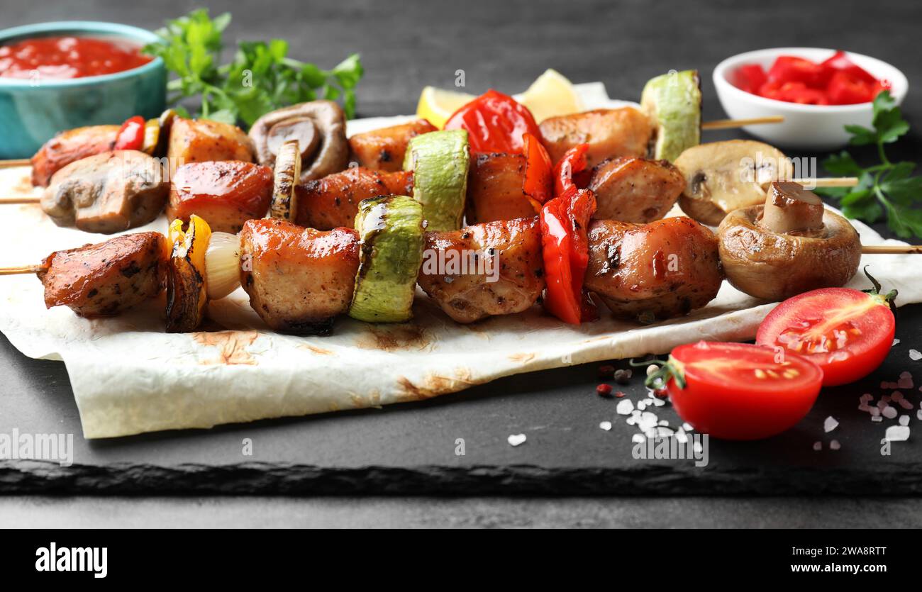 Delicious shish kebabs with mushroom, onion, tomato and zucchini on ...