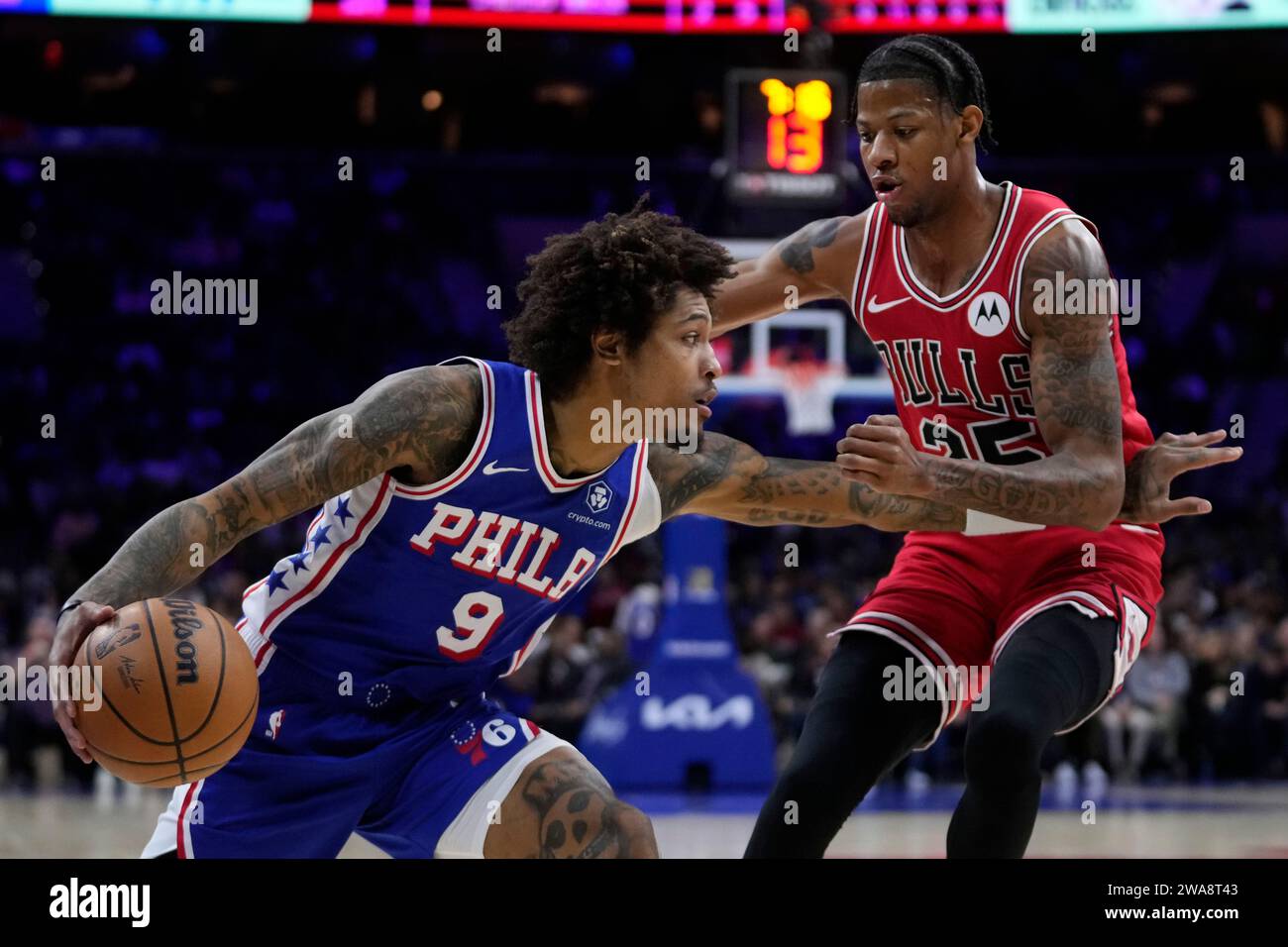 Philadelphia 76ers' Kelly Oubre Jr., left, tries to get past Chicago ...