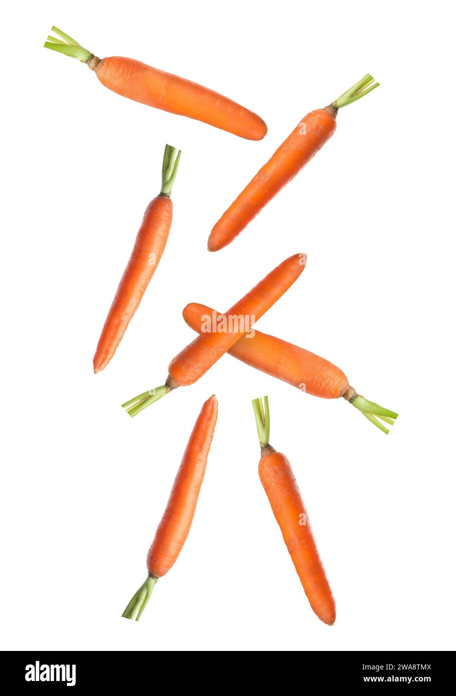 Fresh ripe carrots falling on white background Stock Photo - Alamy