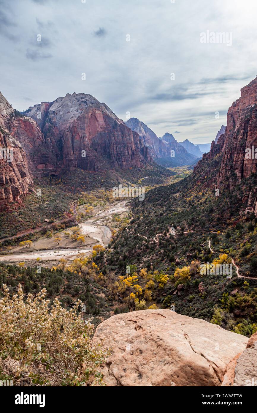 The Zion Canyon with the Virgin River and a hiking trail leading up to ...
