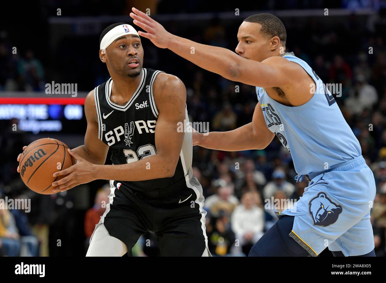 San Antonio Spurs guard Malaki Branham, left, is defended by Memphis ...
