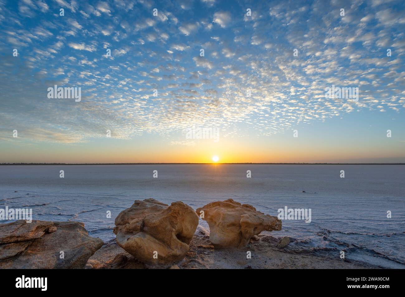 Sun on the horizon and mackerel sky at sunrise over remote Koorkoordine ...