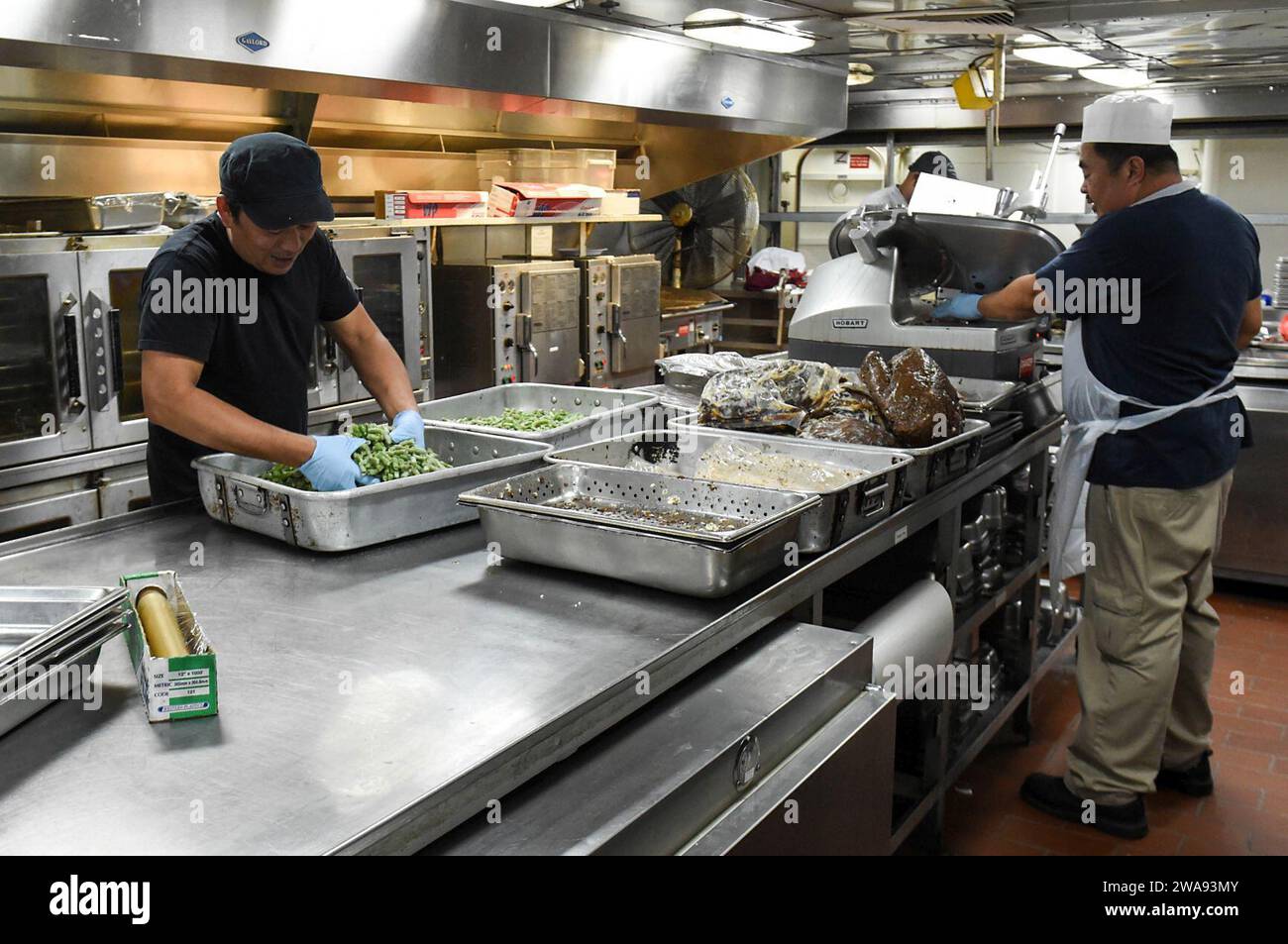 Crew prepare dinner in hi-res stock photography and images - Alamy