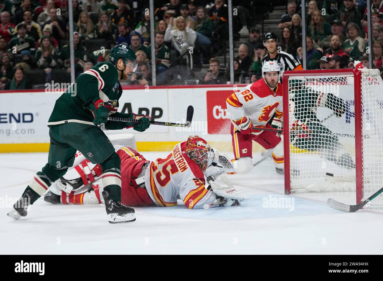 Calgary Flames goaltender Jacob Markstrom (25) gives up a goal to Minnesota Wild left wing Pat ...