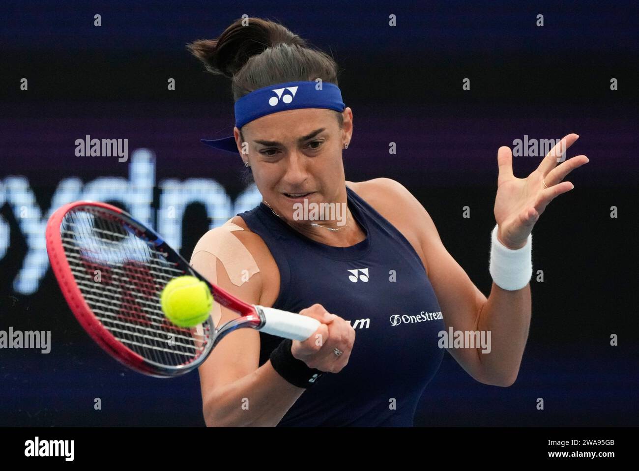 Caroline Garcia of France plays a forehand return to Italy's Jasmine ...