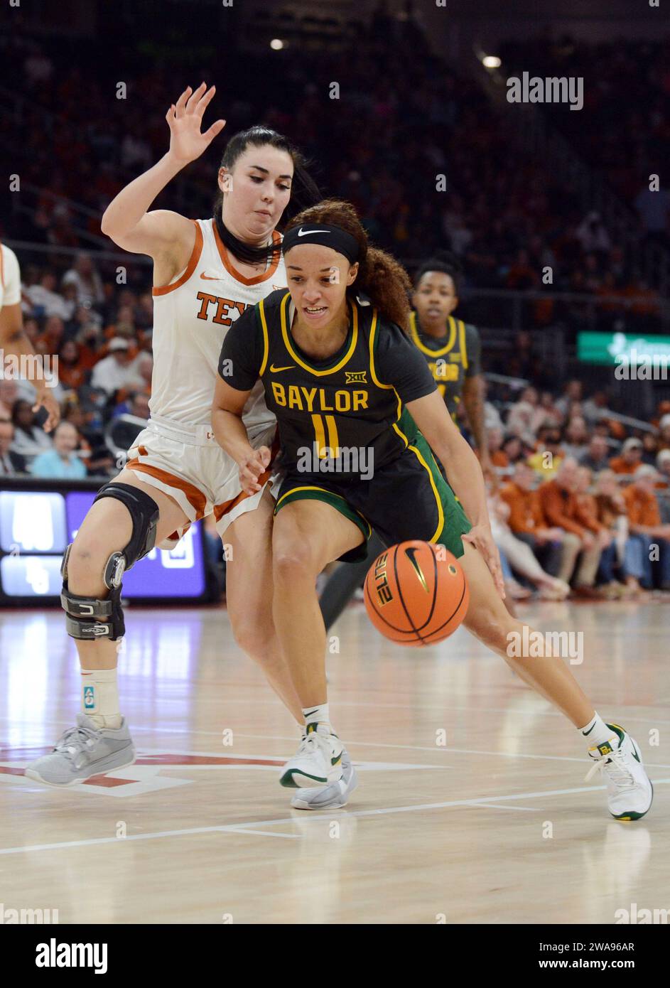 AUSTIN, TX - DECEMBER 30: Baylor Bears guard Jada Walker is defended by ...