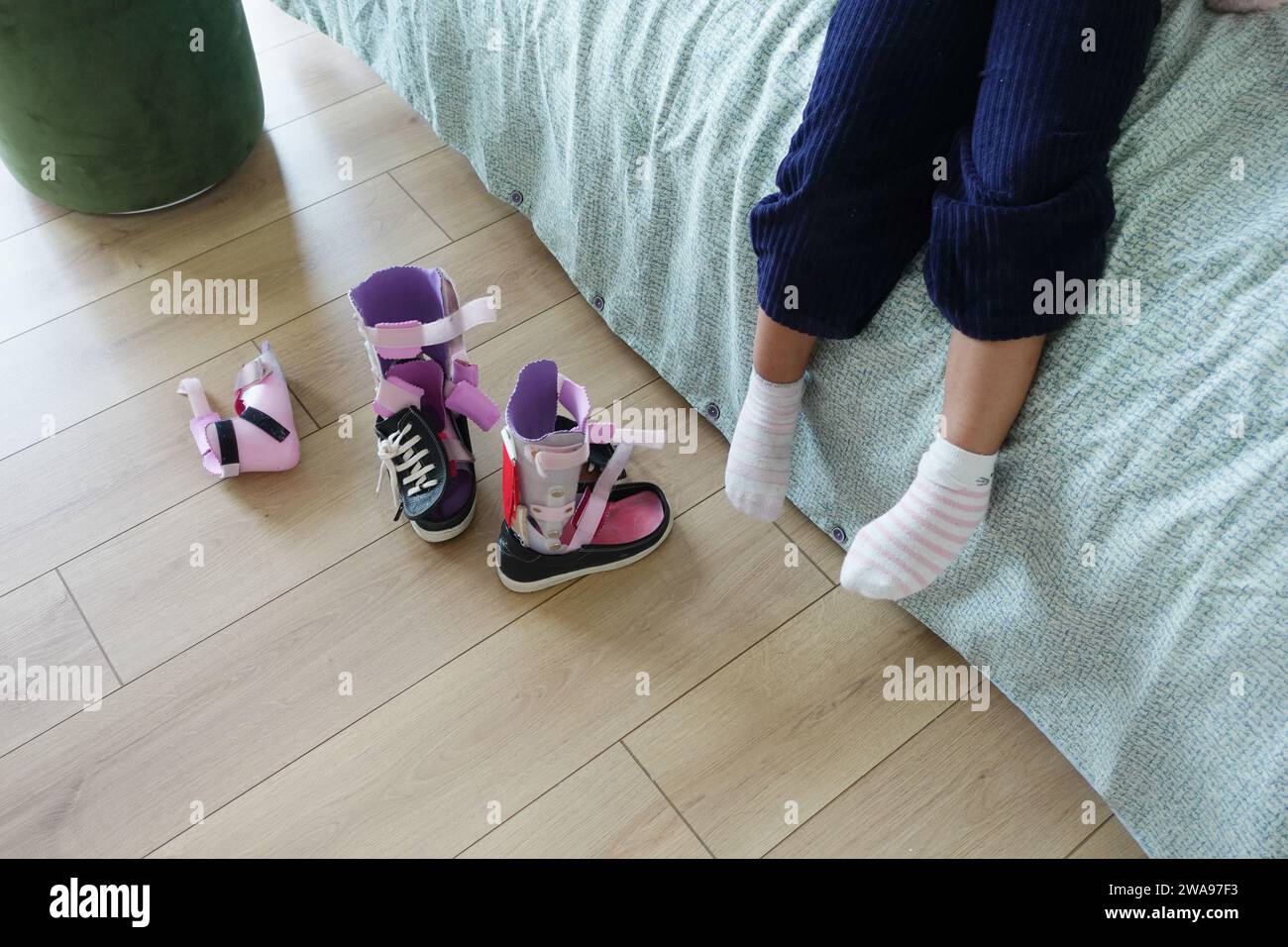 Child cerebral palsy disability, legs orthosis Stock Photo - Alamy