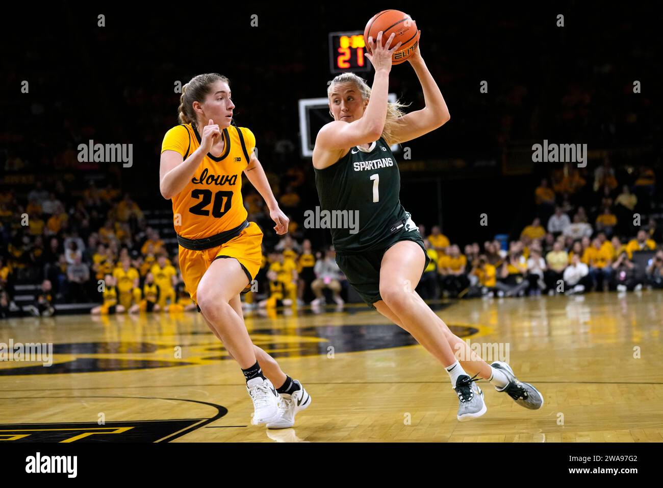 Michigan State guard Tory Ozment (1) drives to the basket past Iowa ...