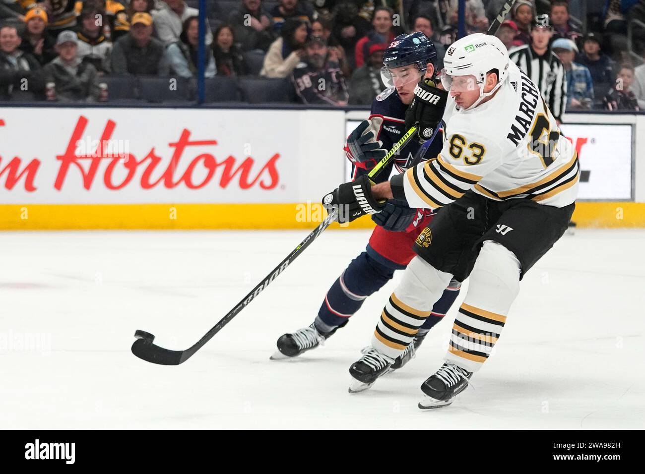 Boston Bruins left wing Brad Marchand (63) takes a shot in front of ...