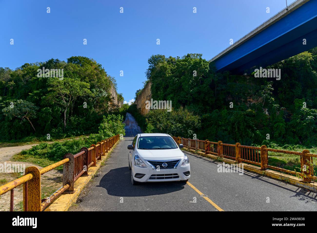 Car parked in the sun on one of the two bridges over the Chavon River ...