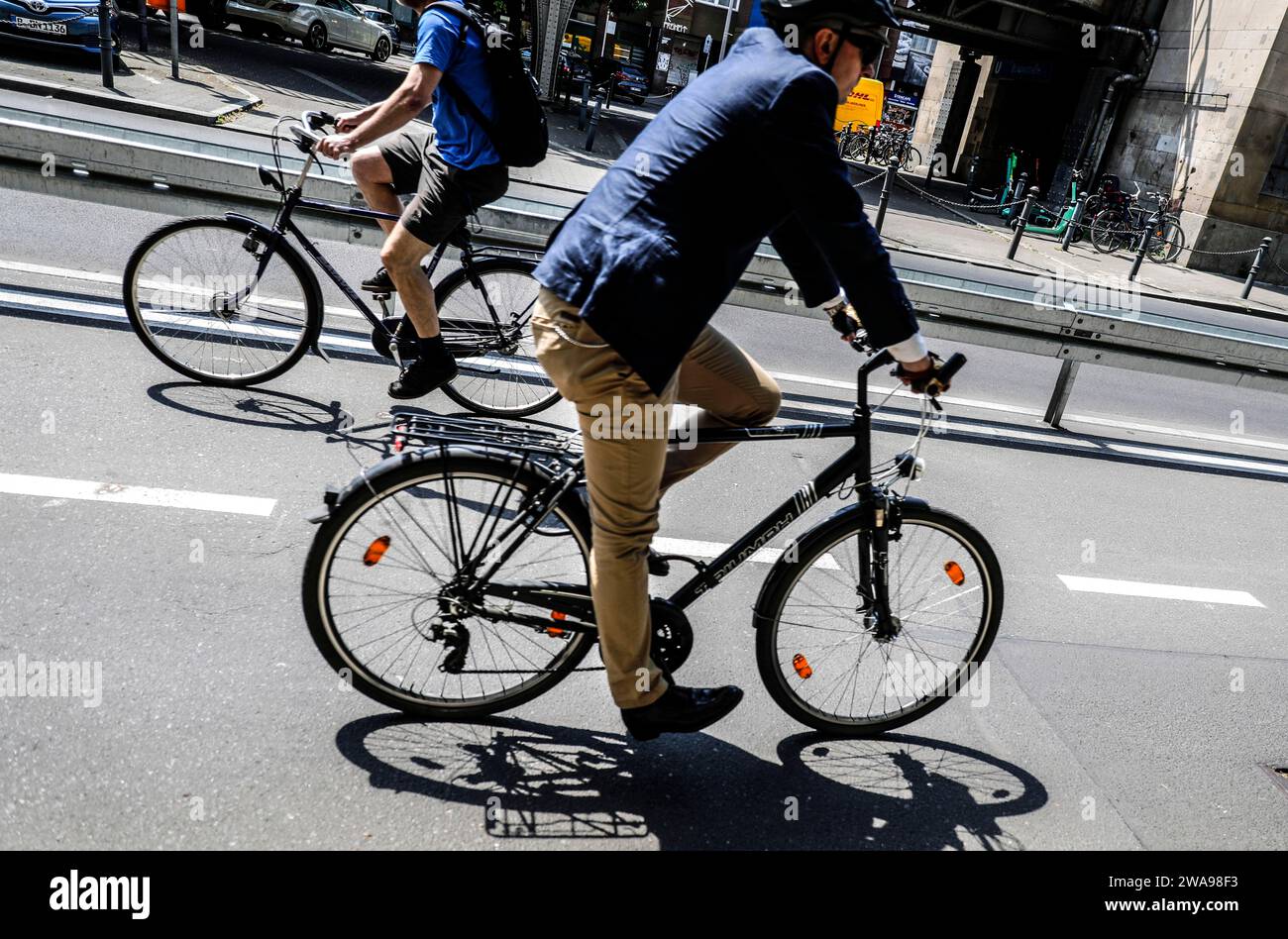 Cyclists using a protected cycle path, Berlin, 07.06.2023 Stock Photo ...