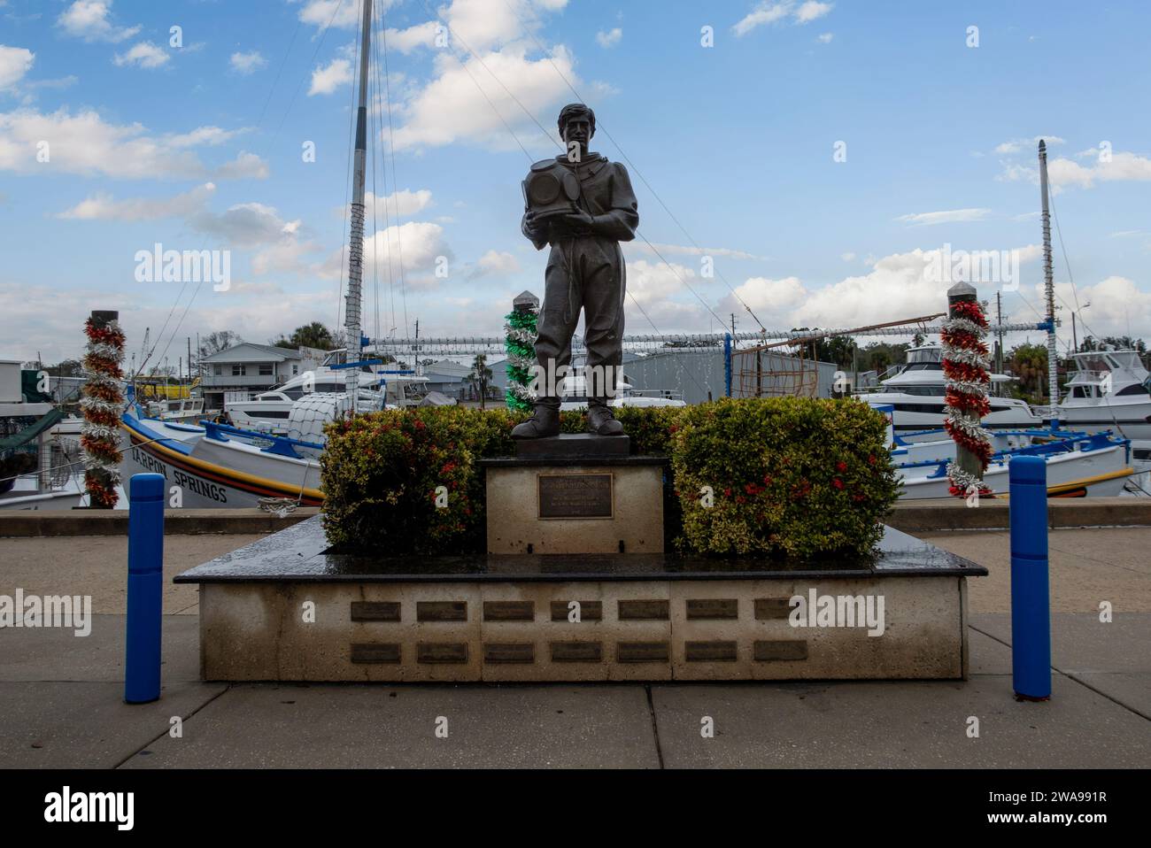 A statue of a sponge diver on the docks at Tarpon Springs, Florida, USA ...