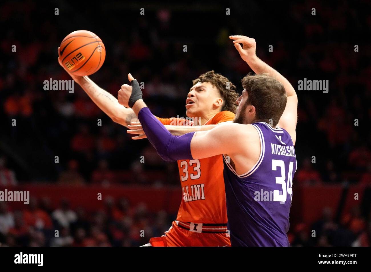 Illinois' Coleman Hawkins drives to the basket as Northwestern's ...