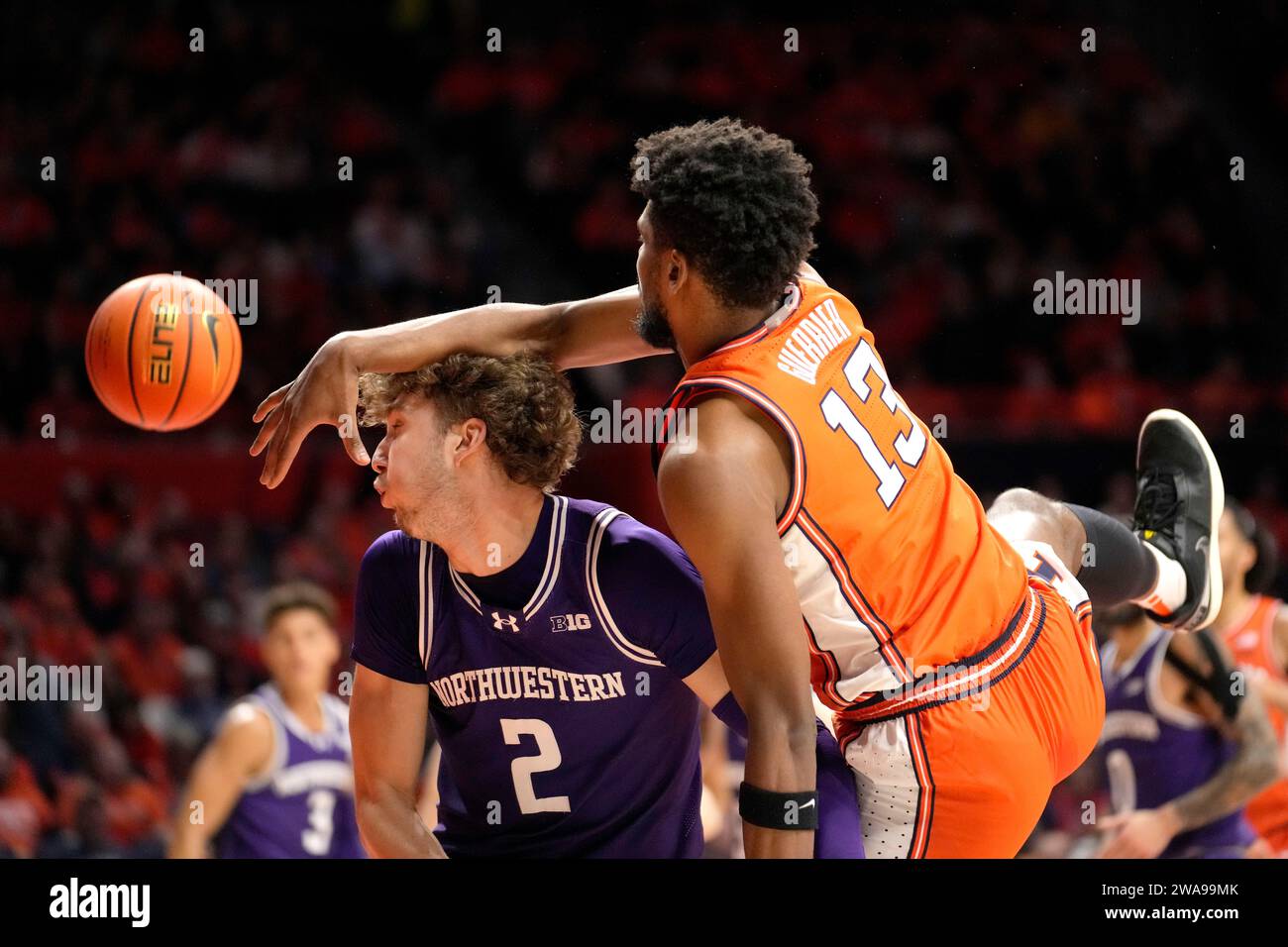 Northwestern's Nick Martinelli (2) gets between an inbound pass intended for Illinois' Quincy ...
