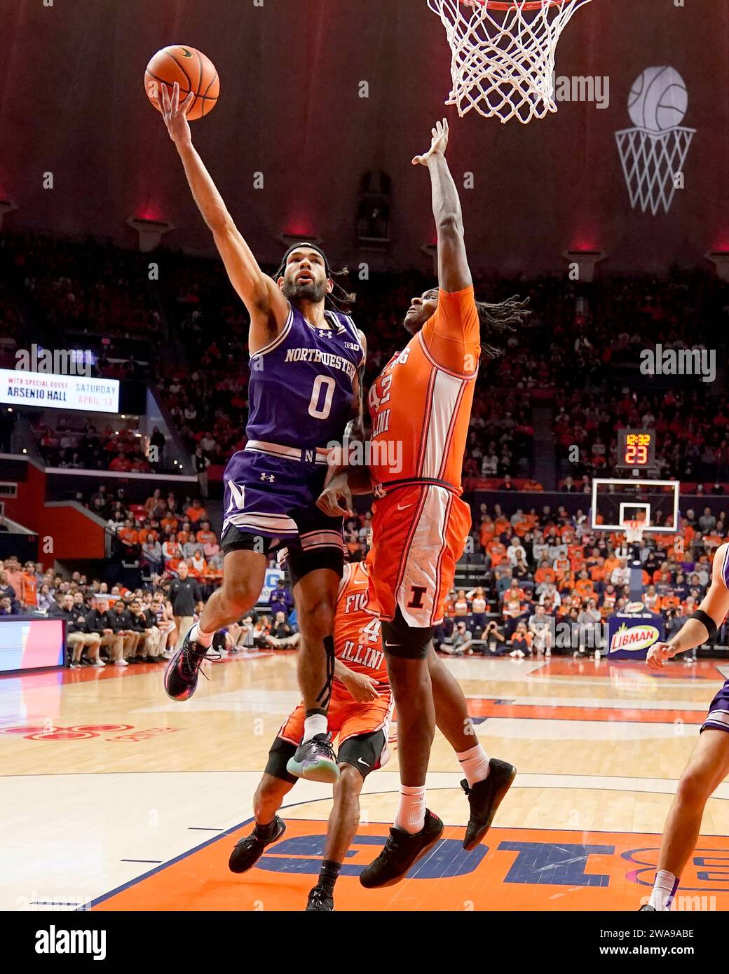 Northwestern's Boo Buie drives to the basket as Illinois' Dain Dainja ...
