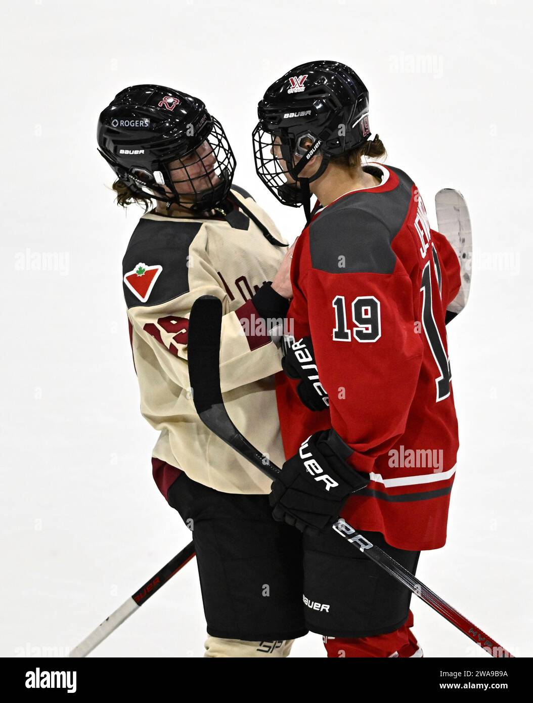 Montreal's Marie-Philip Poulin (29) embraces Ottawa's Brianne Jenner ...
