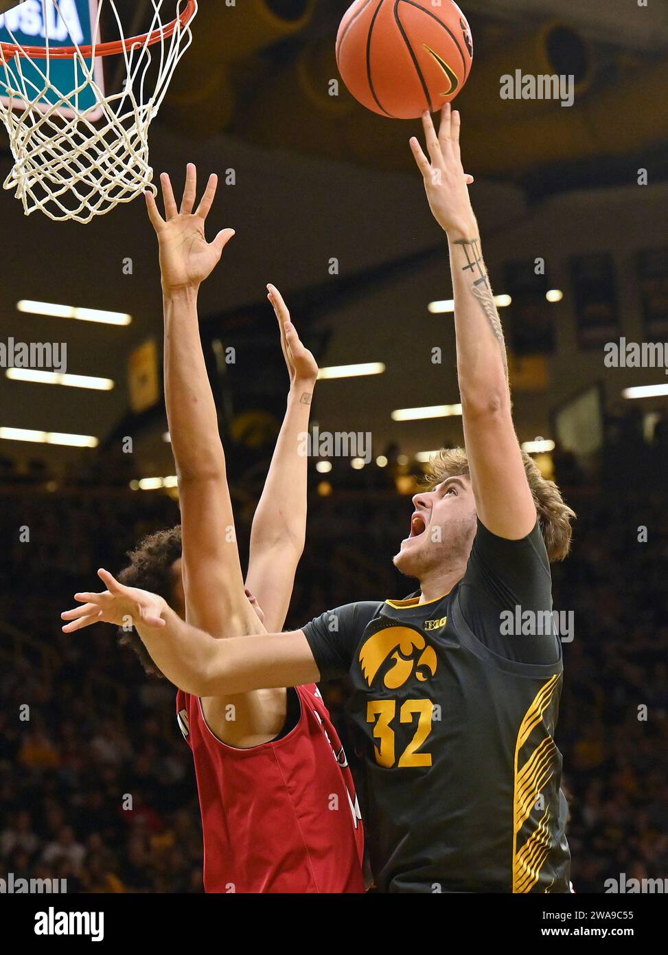 IOWA CITY, IA - DECEMBER 29: Iowa forward Owen Freeman (32) puts up a ...