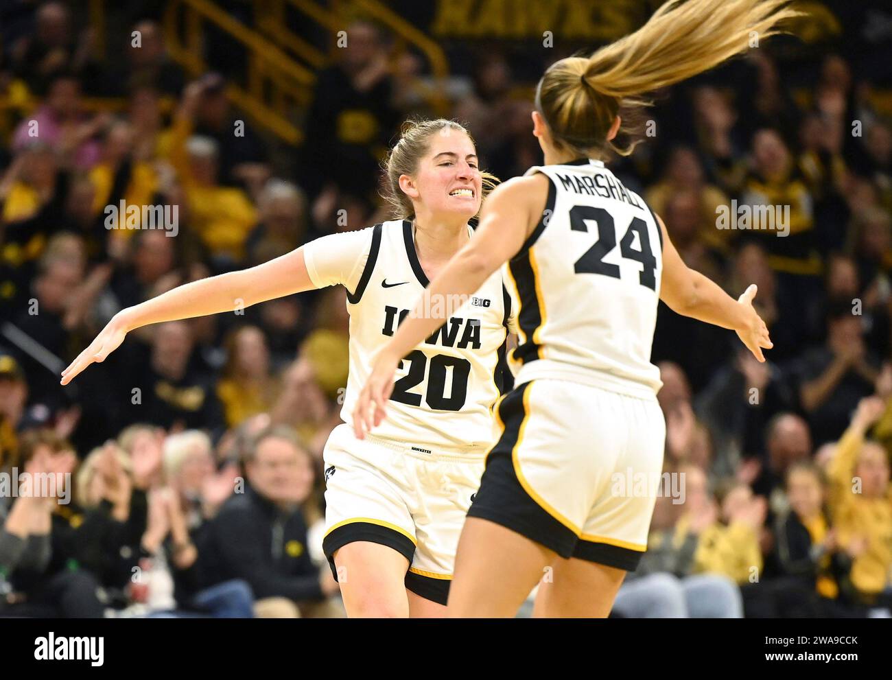 IOWA CITY, IA - DECEMBER 30: Iowa guard Kate Martin (20) and Iowa guard ...