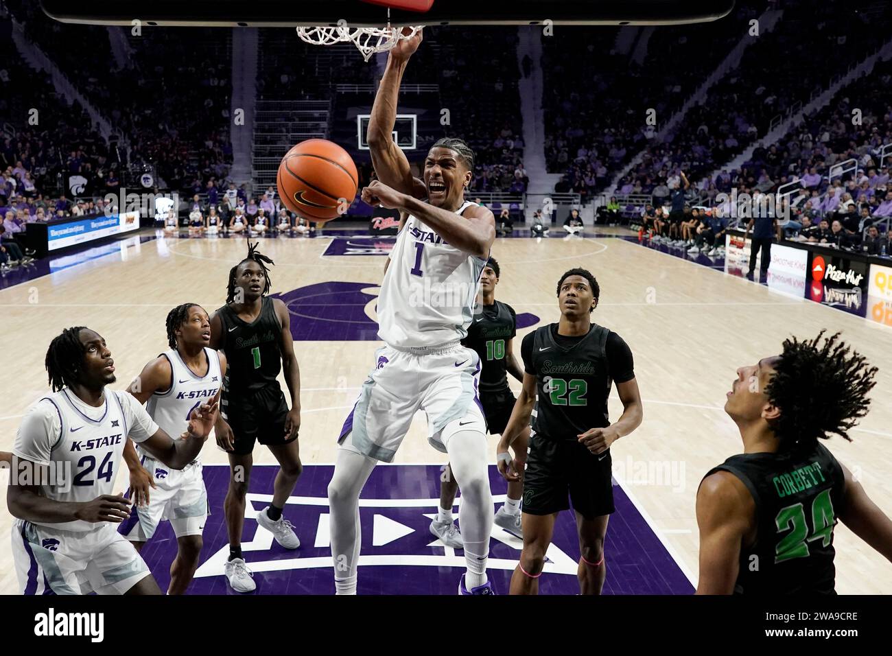 Kansas State forward David N'Guessan (1) dunks the ball during the ...