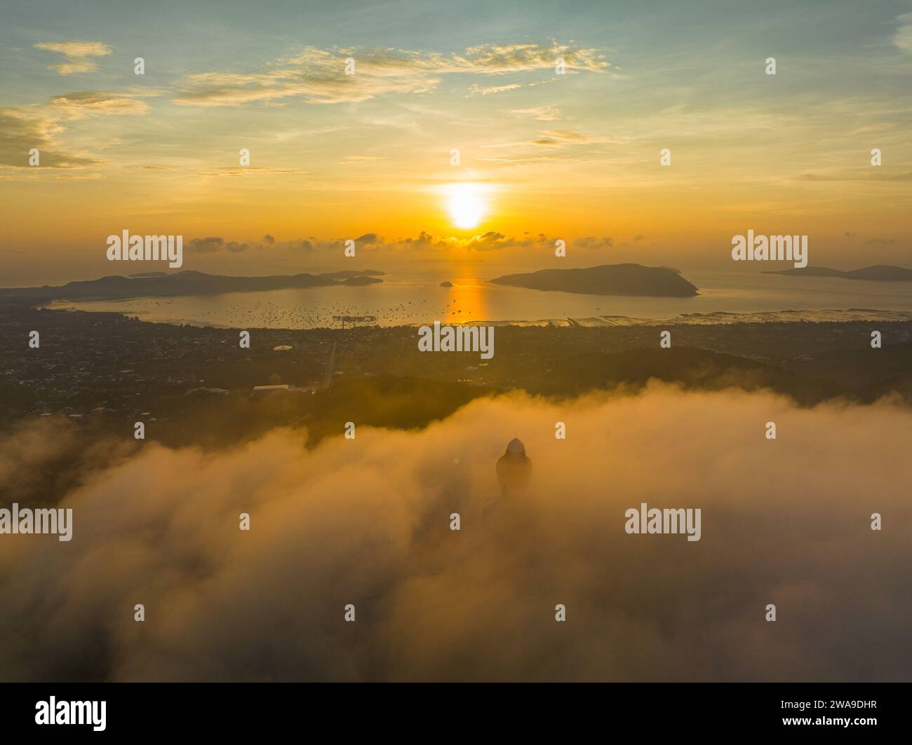 aerial view bright yellow sun in sunrise at Phuket big Budha. Golden ...