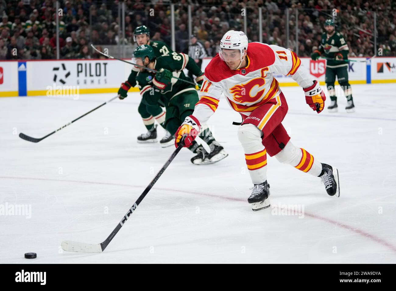 Calgary Flames center Mikael Backlund (11) skates with the puck during ...
