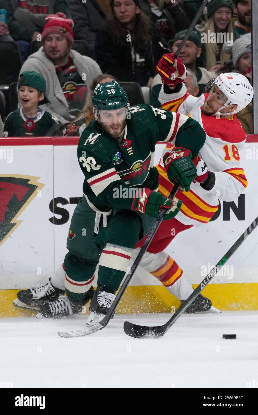 Minnesota Wild right wing Ryan Hartman (38) reaches for the puck as ...