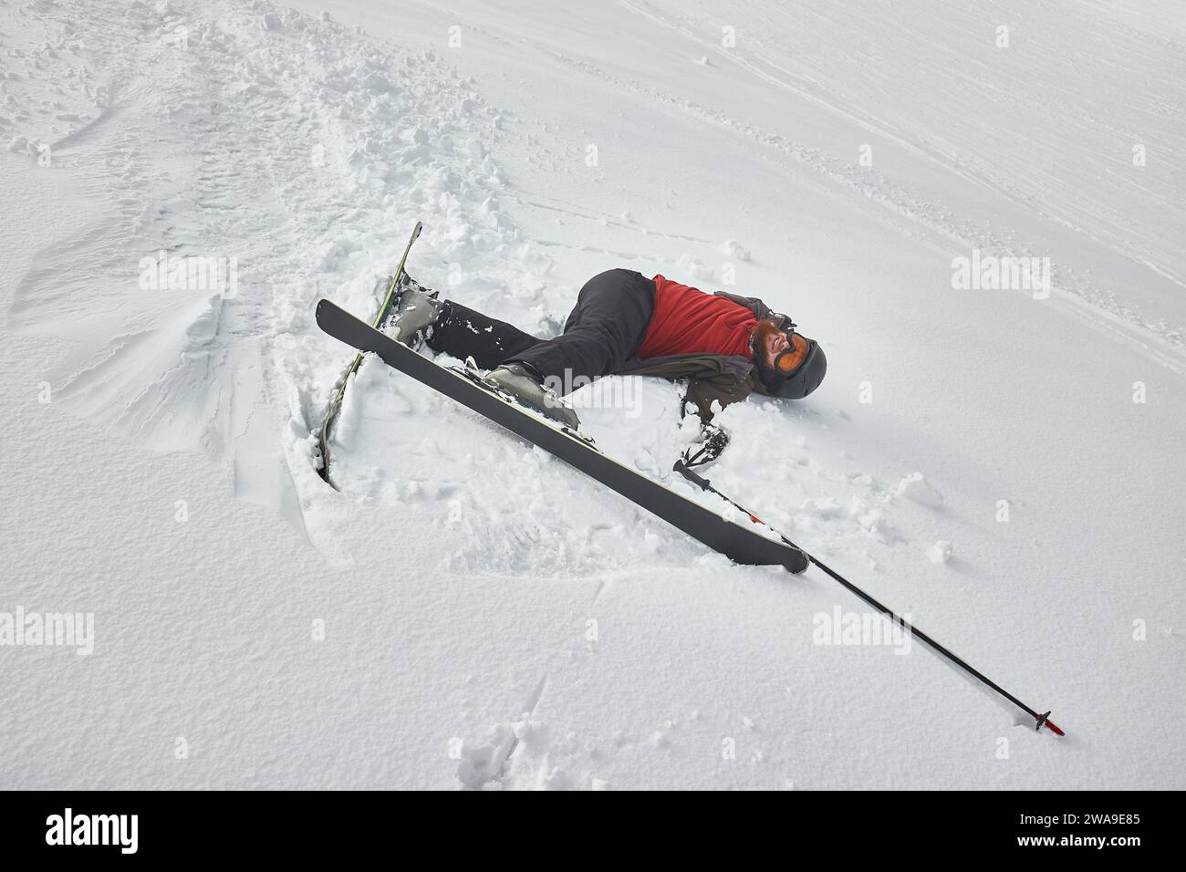 Skiing in the winter fallen over Stock Photo - Alamy