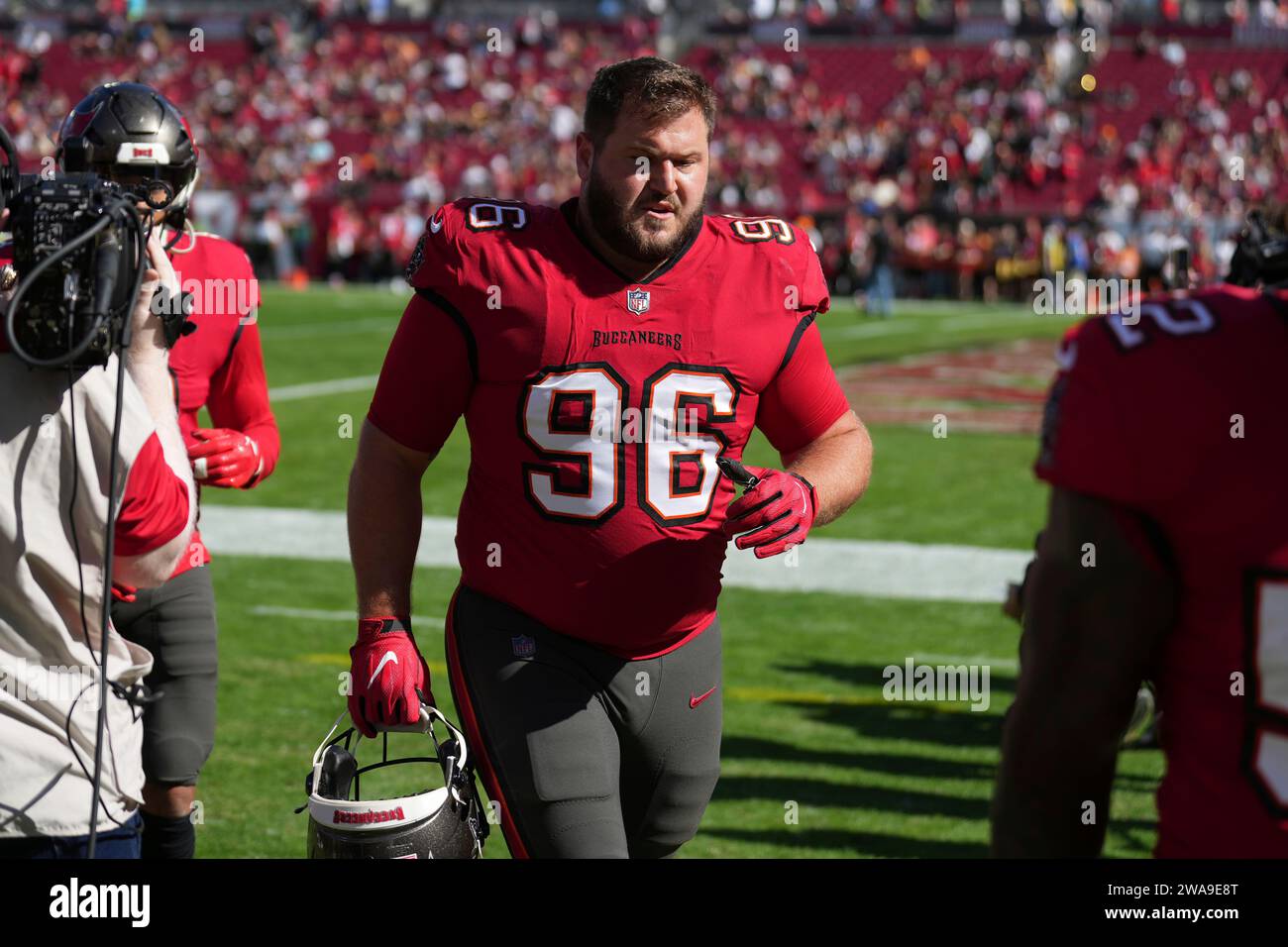 Tampa Bay Buccaneers defensive tackle Greg Gaines (96) jogs into the lock room following pregame ...