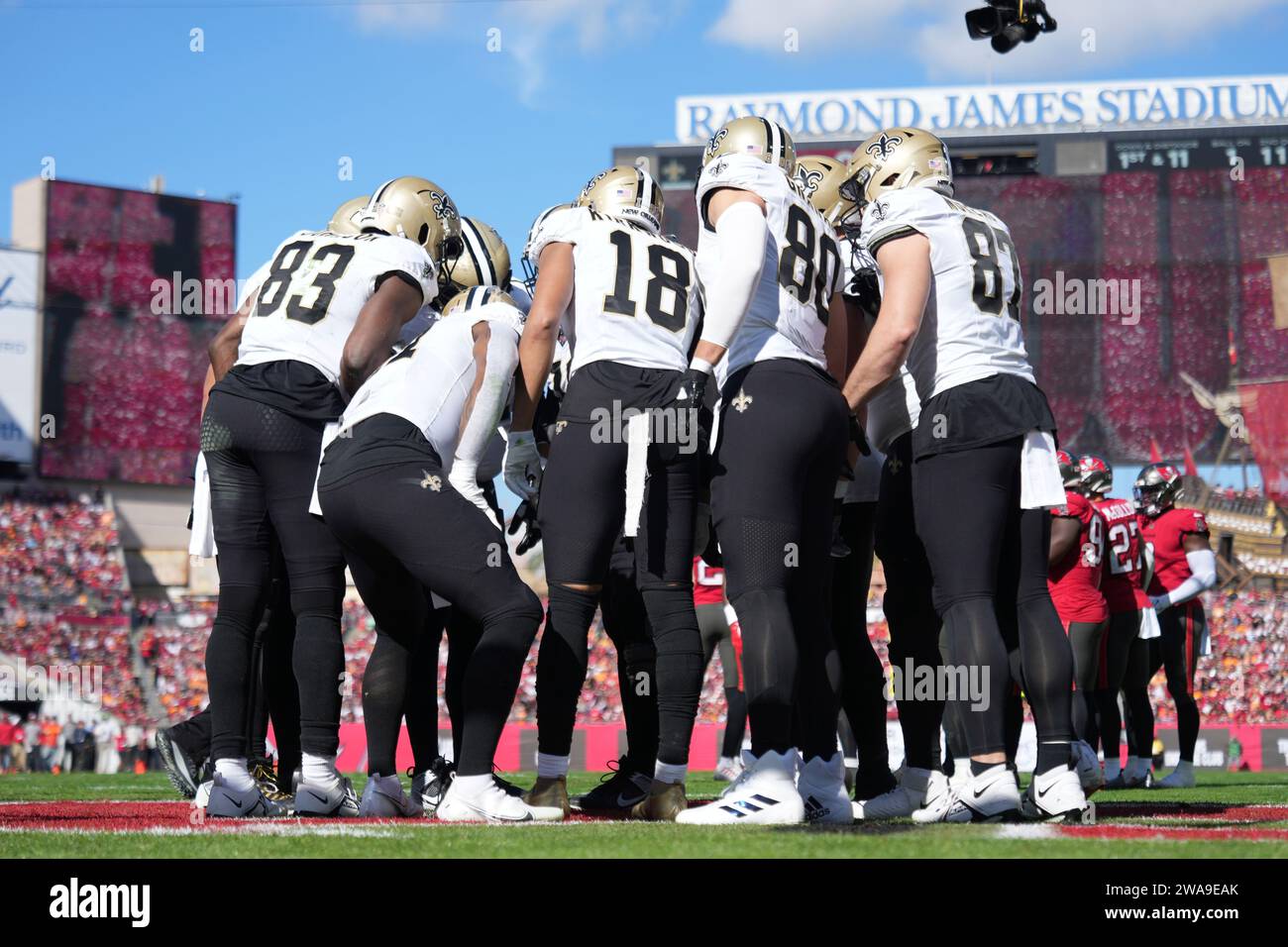 The New Orleans Saints offense huddles during an NFL football game ...
