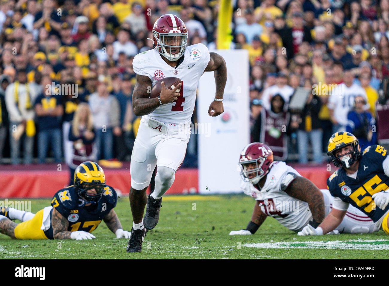 Alabama Crimson Tide quarterback Jalen Milroe (4) runs the ball during the CFP Semifinal at the ...
