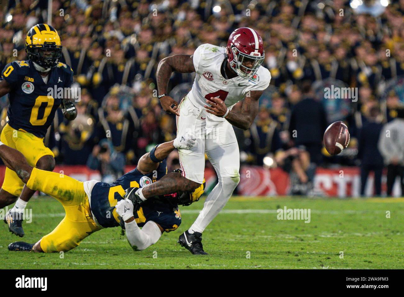 Michigan Wolverines defensive back Quinten Johnson (28) causes a fumble ...