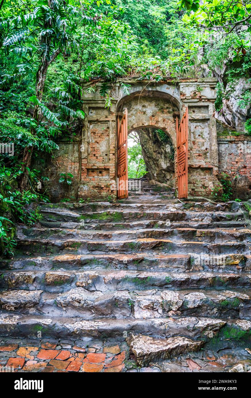 Old stone steps and a gate leading to the Marble Mountain in Vietnam ...