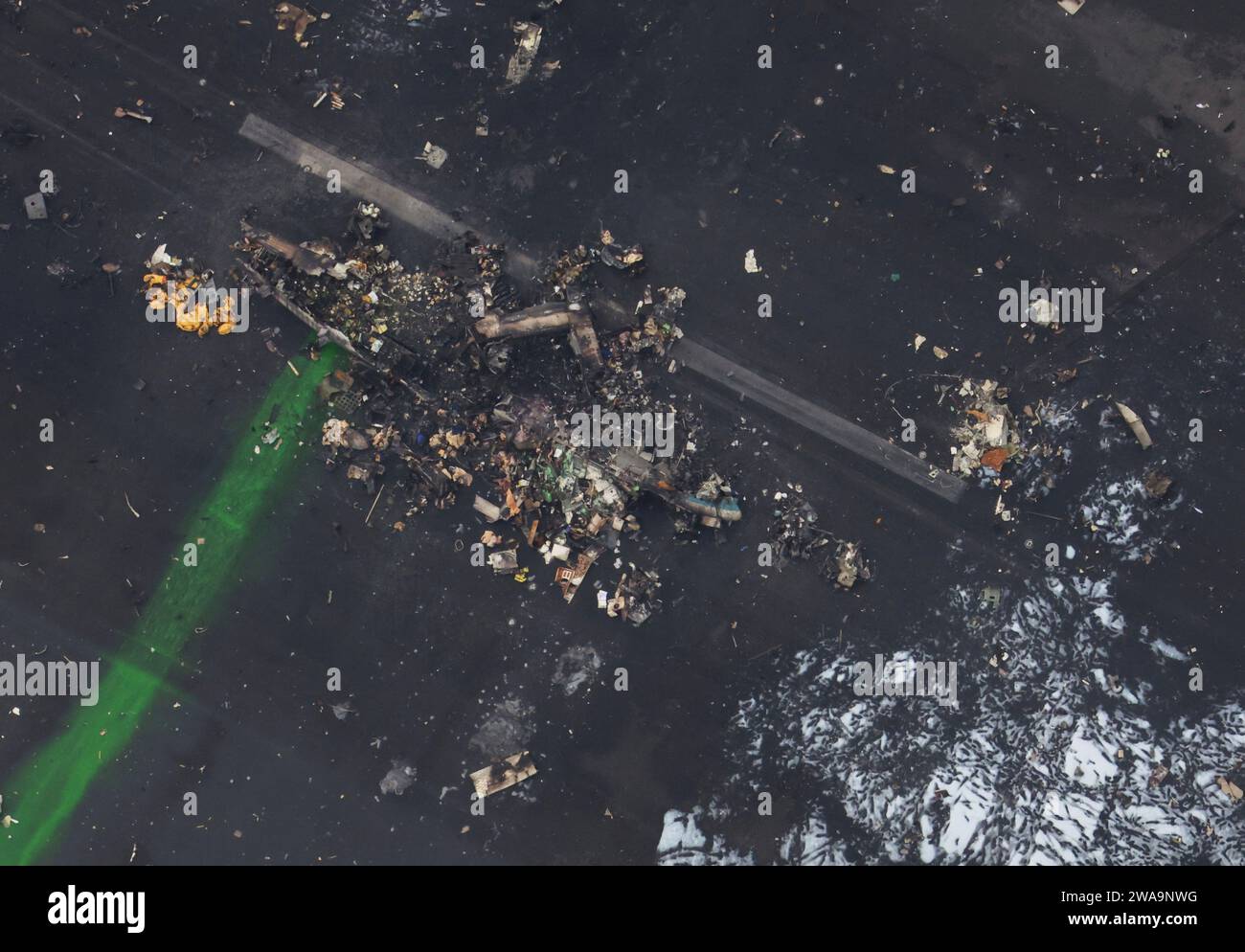 An aerial photo shows a Japan Coast Guard (JCG) aircraft burnt after a ...