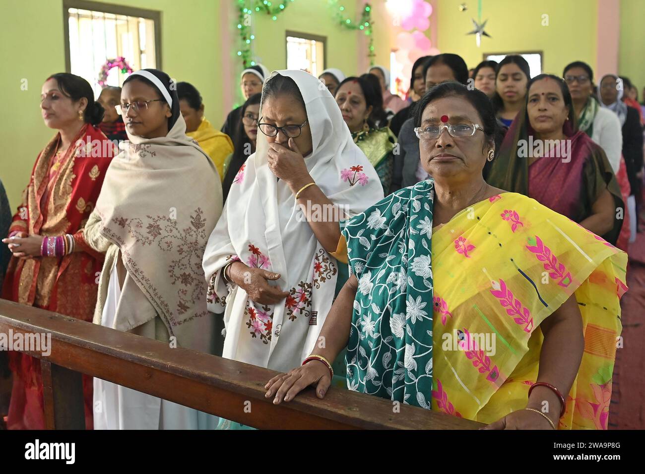 Christians attend a Christmas Mass in Mariam Nagar Church at Agartala ...