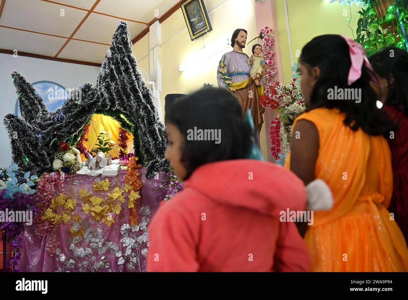 Christians attend a Christmas Mass in Mariam Nagar Church at Agartala ...